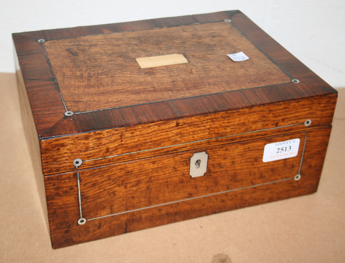 A Victorian oak work box, the hinged lid with a rosewood crossbanded ...