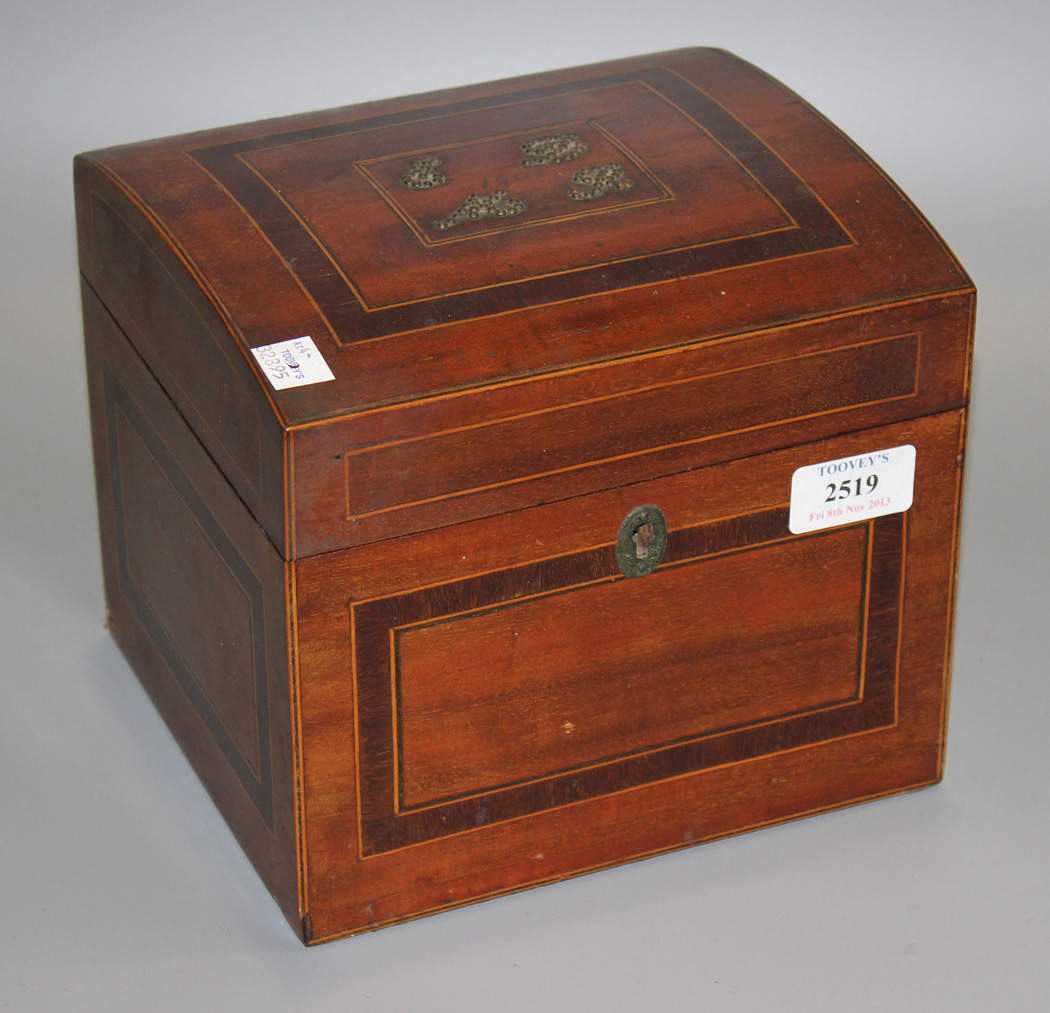 An Edwardian mahogany dome top box with crossbanded decoration, the ...