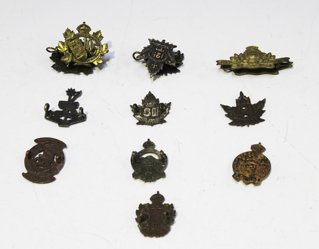 A small collection of Canadian cap and collar badges, including Cameron ...