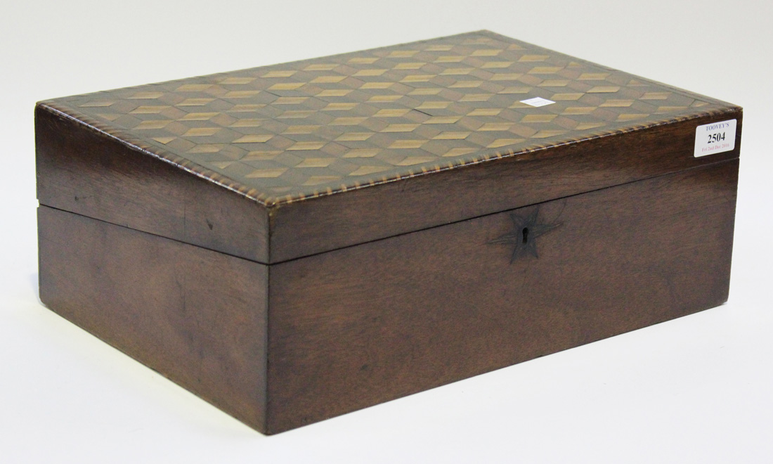 An early Victorian mahogany writing slope, the hinged lid parquetry ...